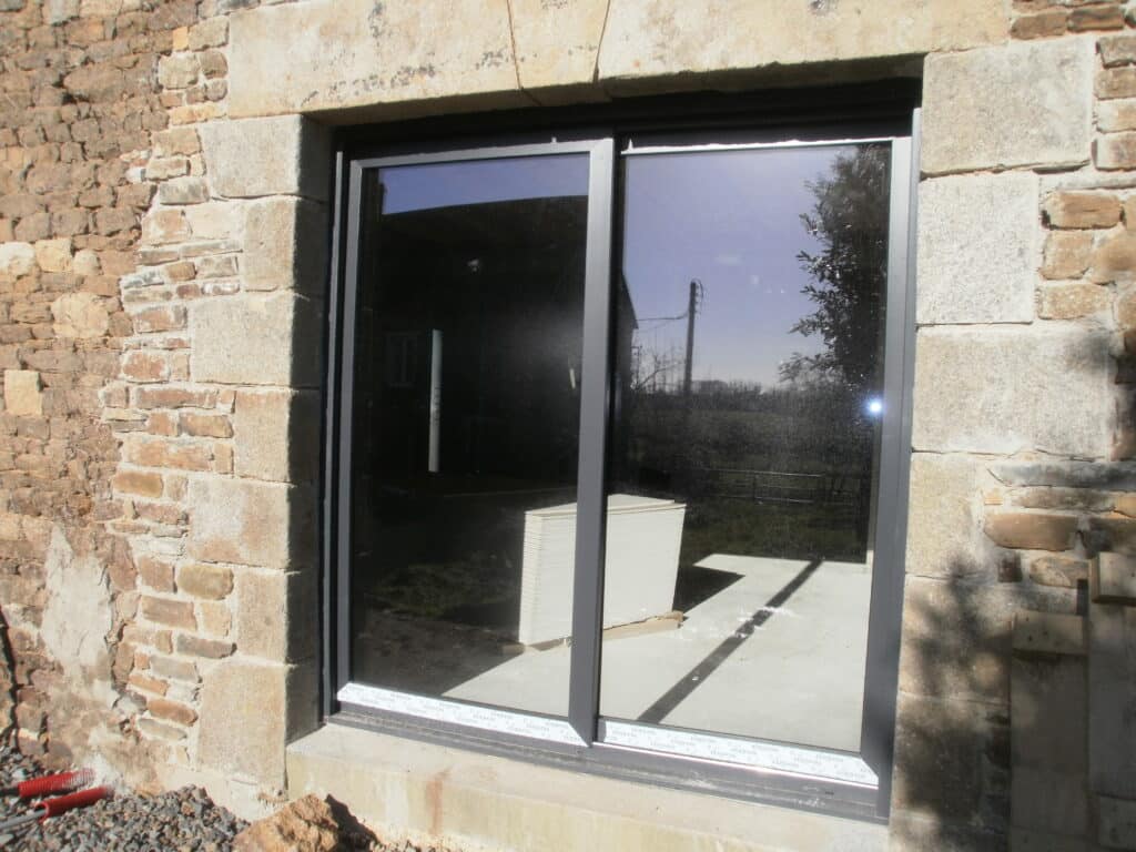 Baie vitrée coulissante en PVC couleur anthracite - PROCLAIR